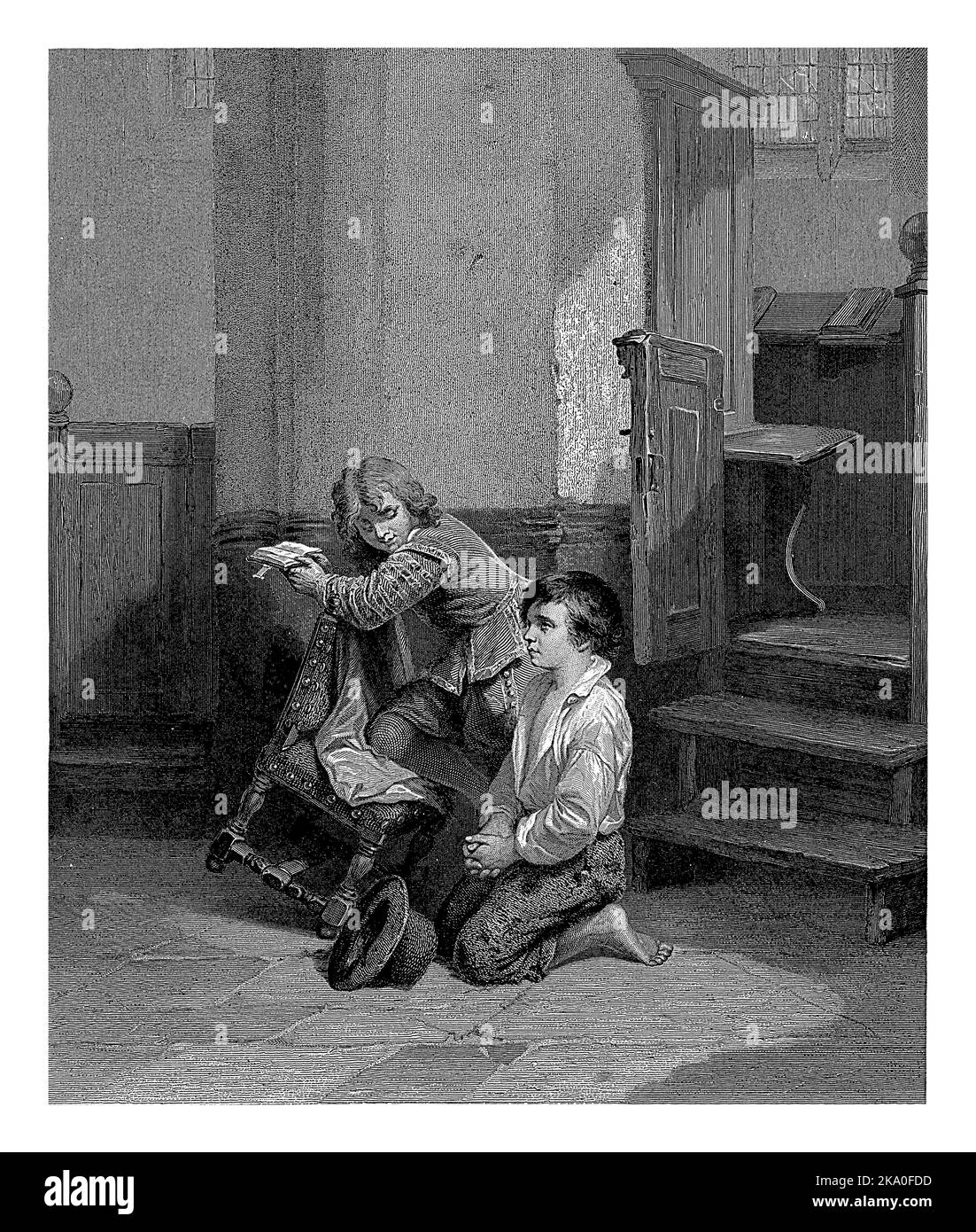 A barefoot boy is kneeling on the floor. He keeps his hands folded. His ...