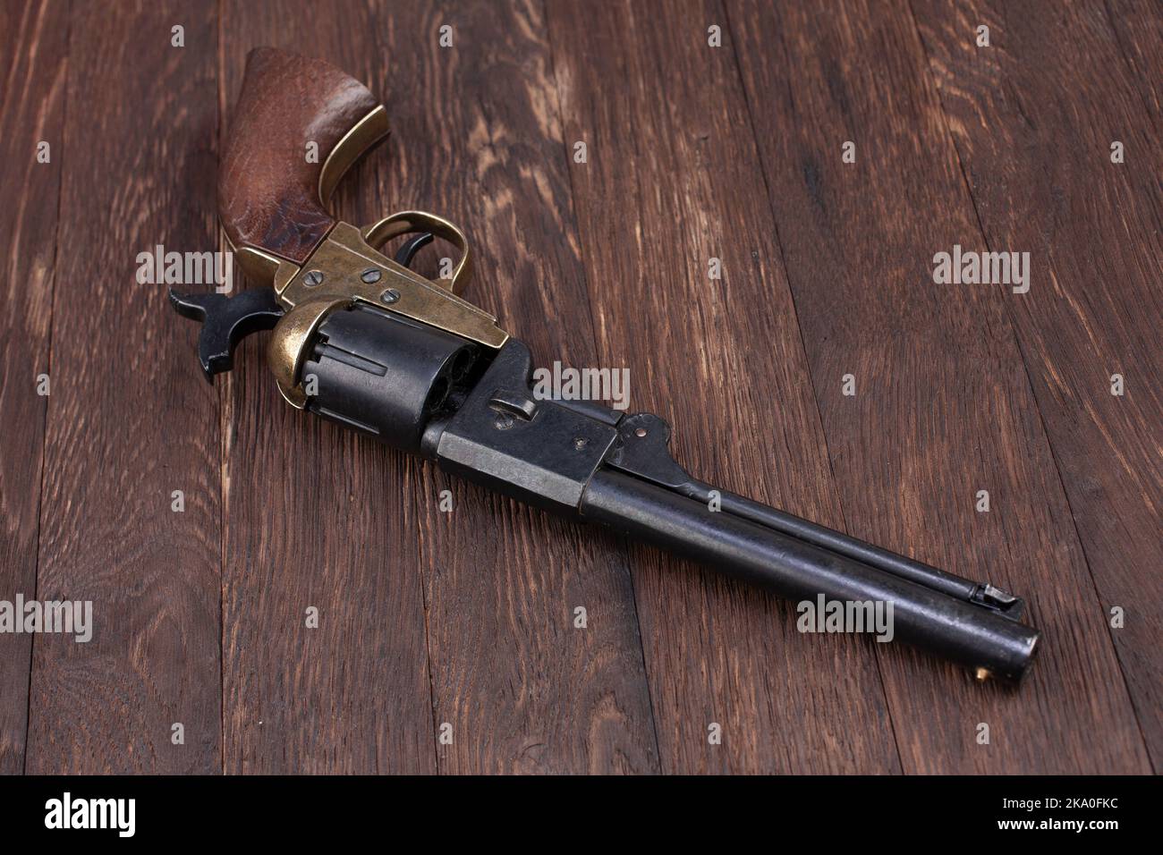 Old West gun - Percussion Army Revolver on wooden table Stock Photo - Alamy