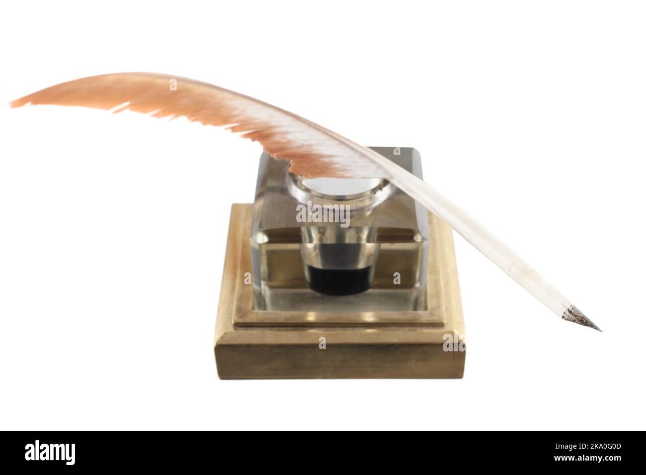 Antique vintage feather quill with glass inkwell isolated on white ...