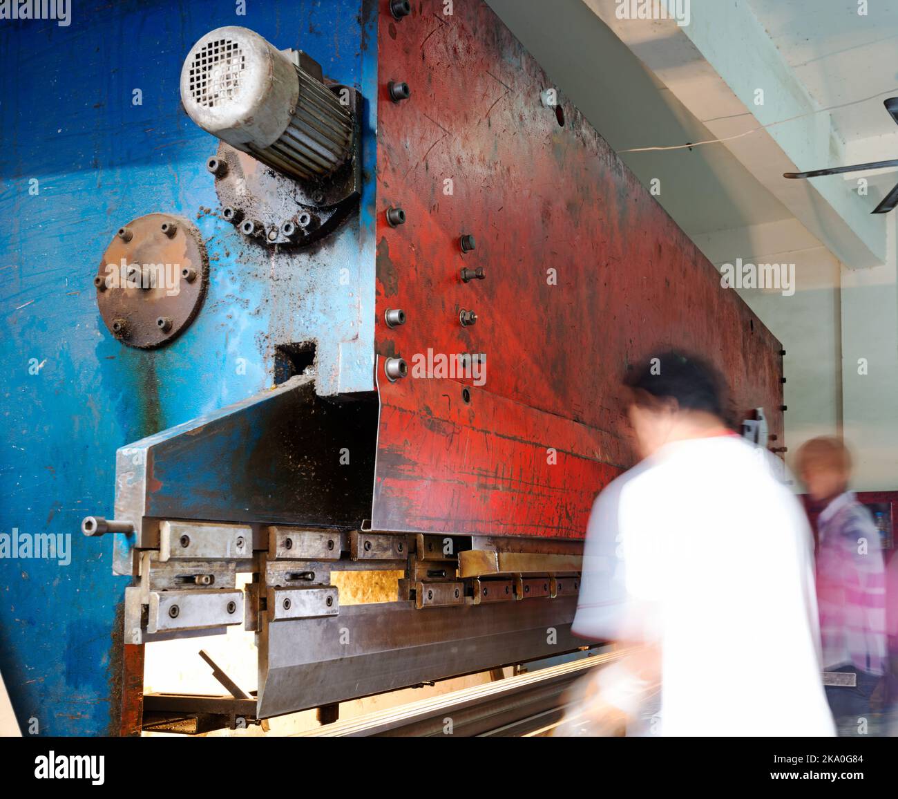 Sheet of metal and hands of worker who works on press Stock Photo - Alamy