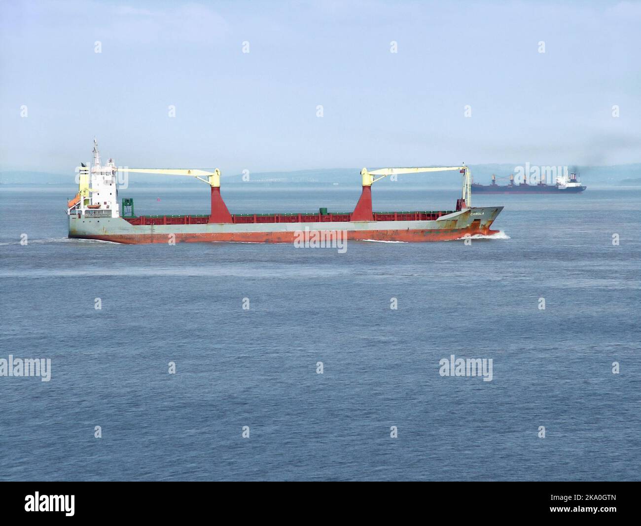 Bulk carrier cargo ship leaving passing Penarth Wales UK, on the Severn ...