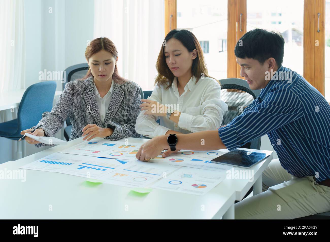 Planning to reduce investment risks, the image of a group of businesspeople working with ...