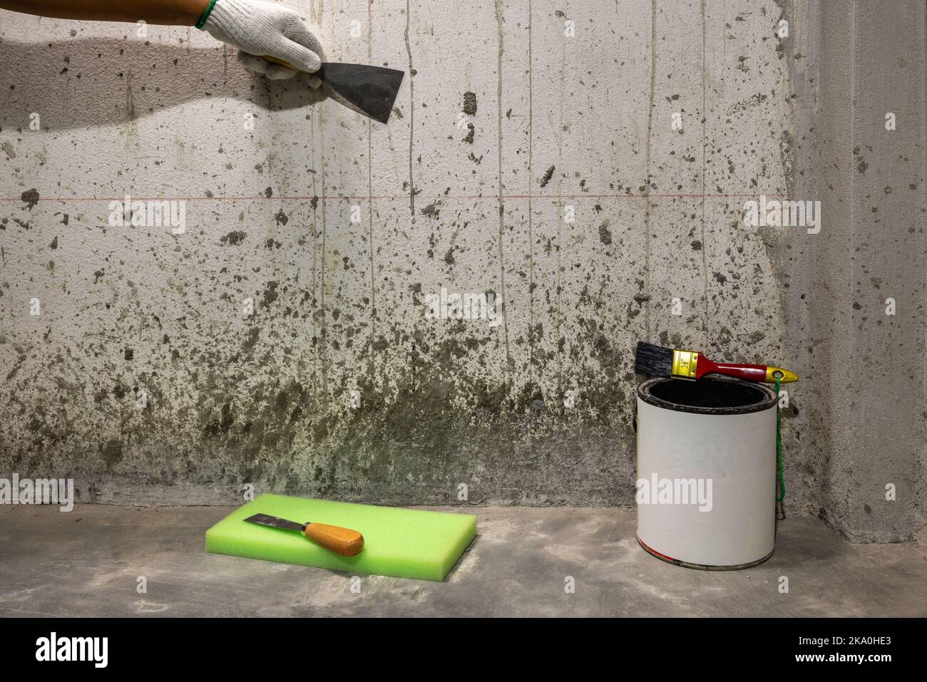 Renovation home , Painter scraping concrete debris from pour new ...