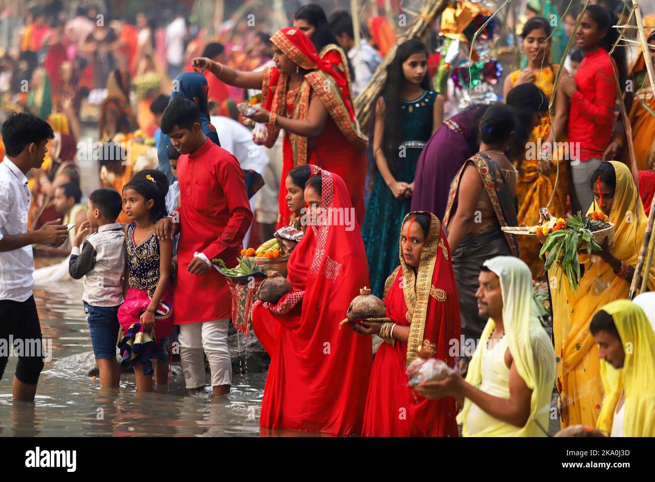 Devotees perform rituals on the occasion of Chhath Puja at the bank of ...