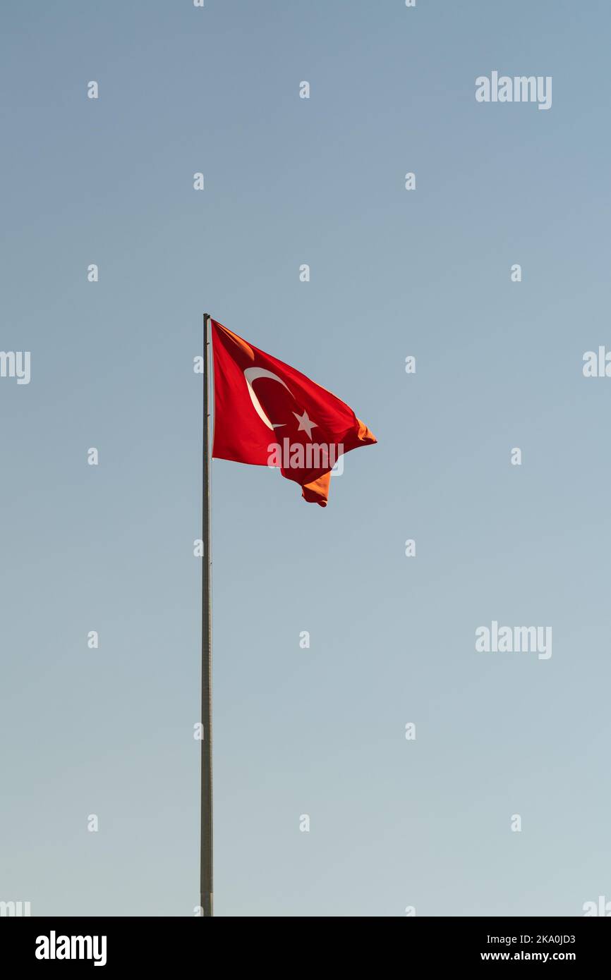 National flag of Turkey featuring white star and crescent waving ...