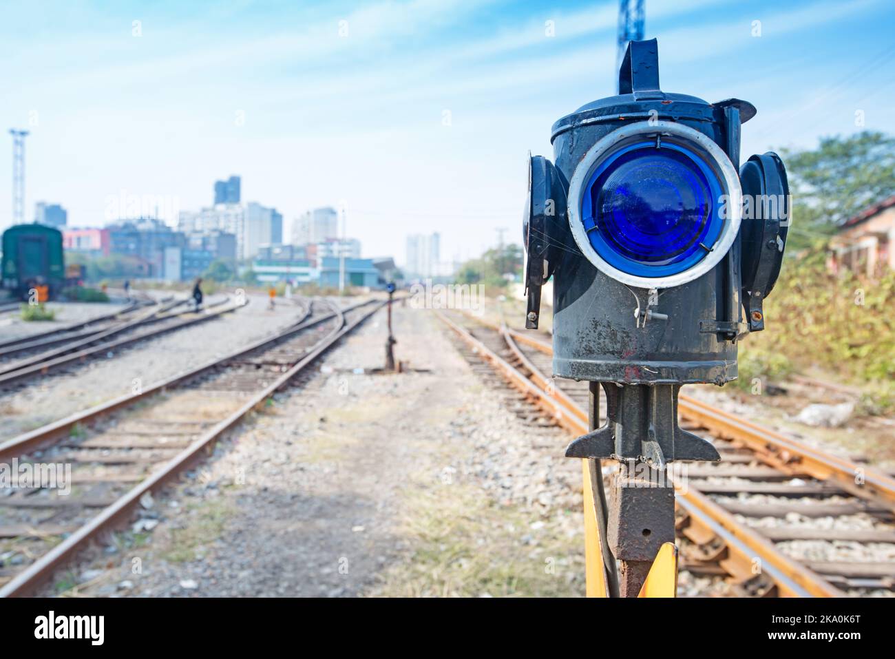 Traffic light shows blue signal on railway Stock Photo - Alamy