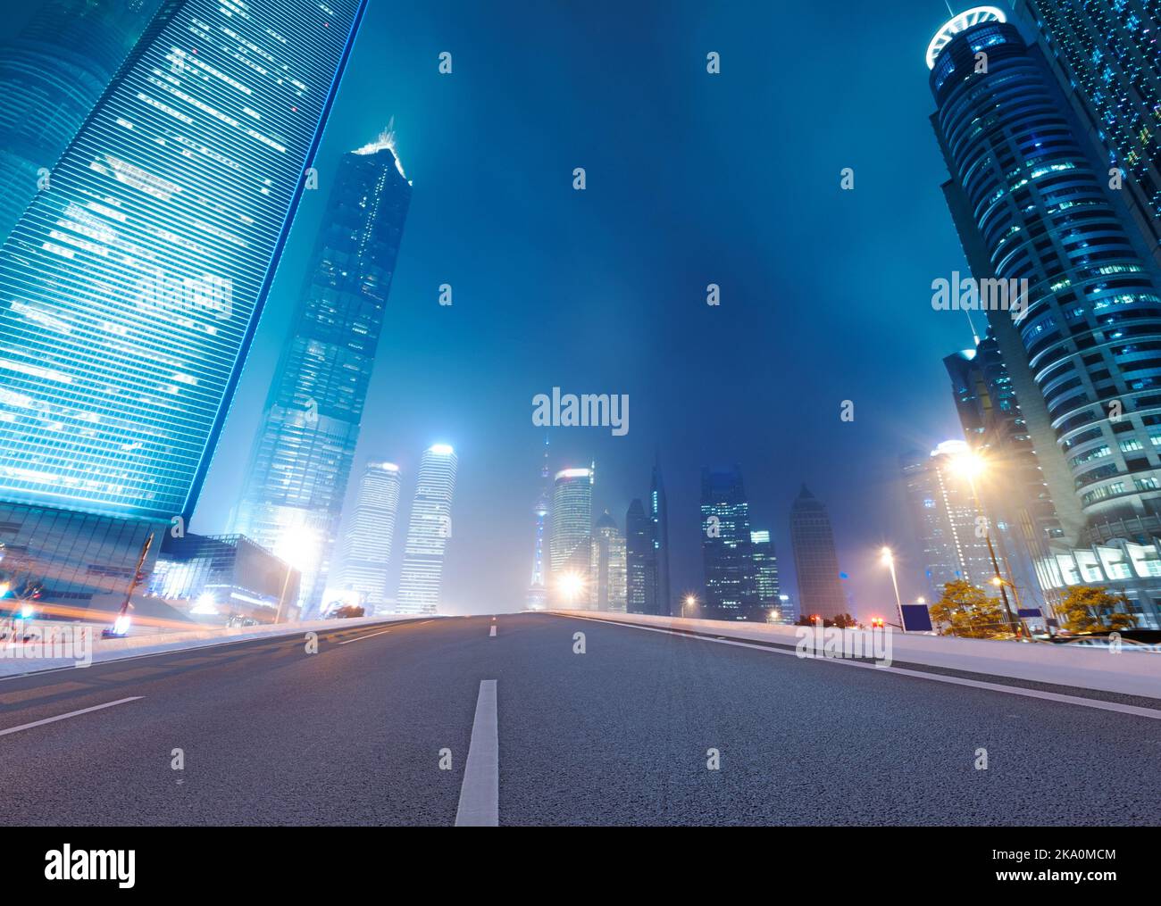 Asphalt road and modern city Stock Photo - Alamy