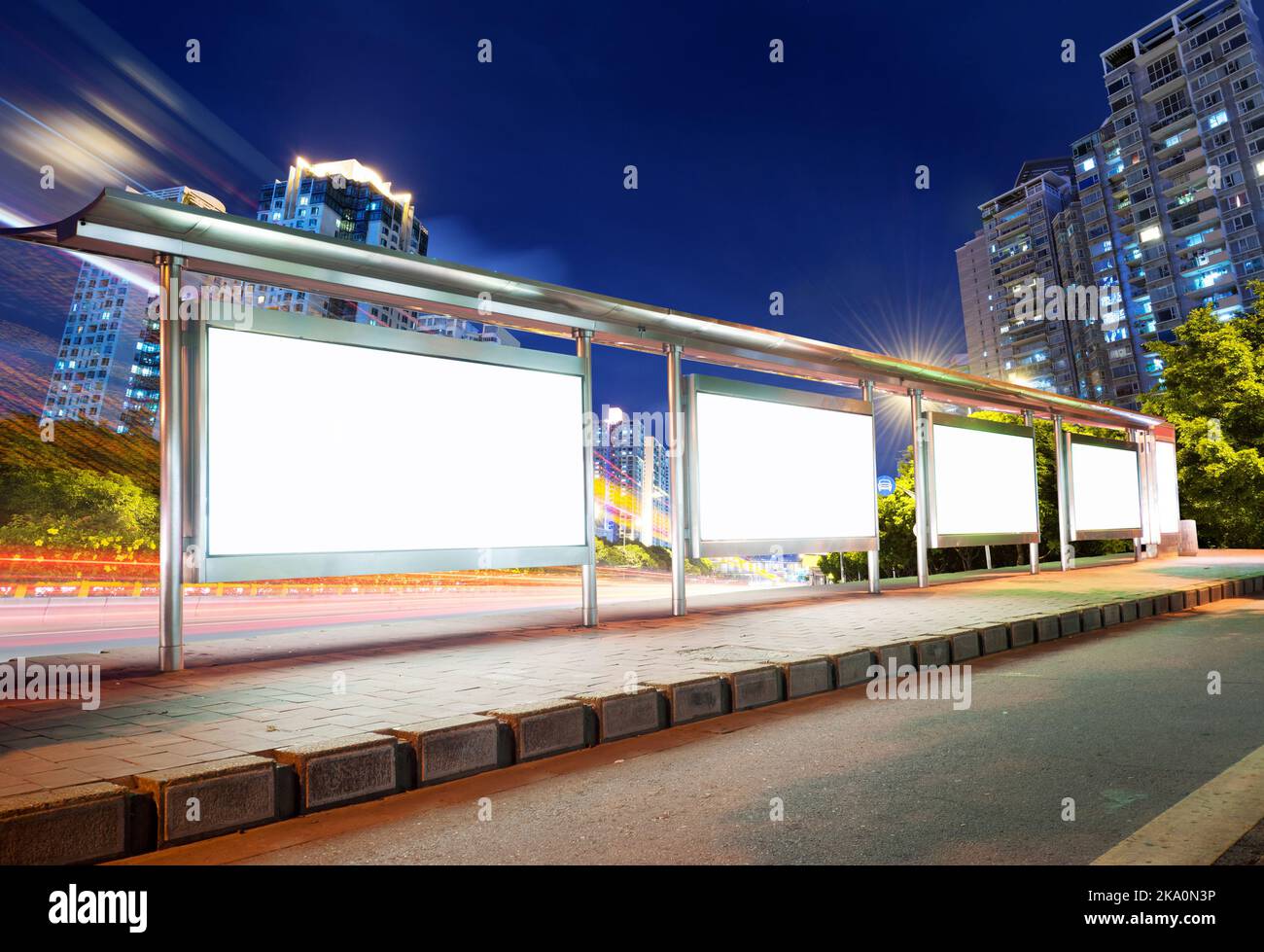 Blank billboard on bus stop at night Stock Photo - Alamy
