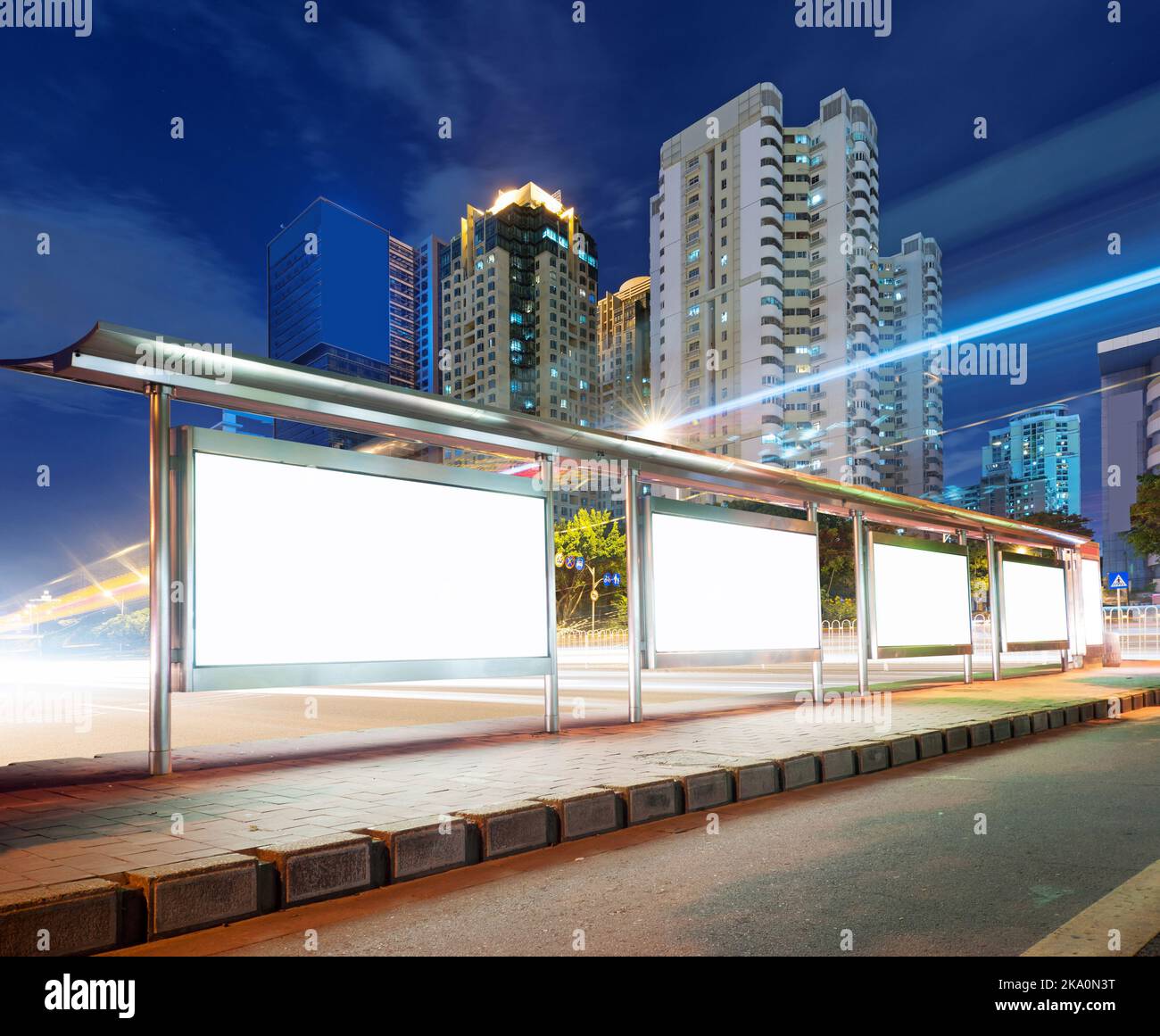 Blank billboard on bus stop at night Stock Photo - Alamy