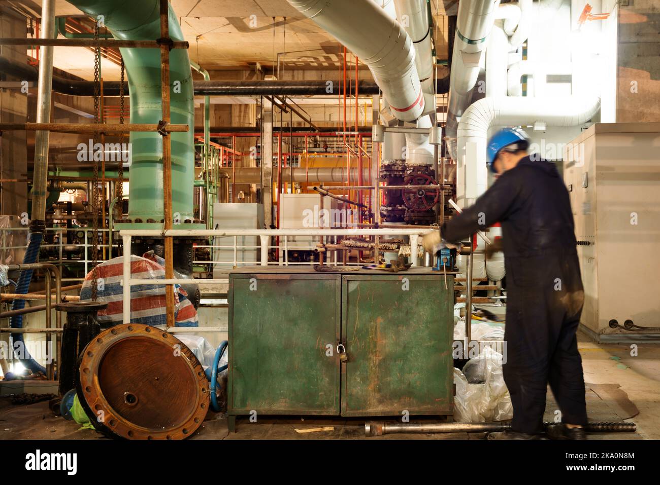Equipment, cables and piping as found inside of industrial power plant ...