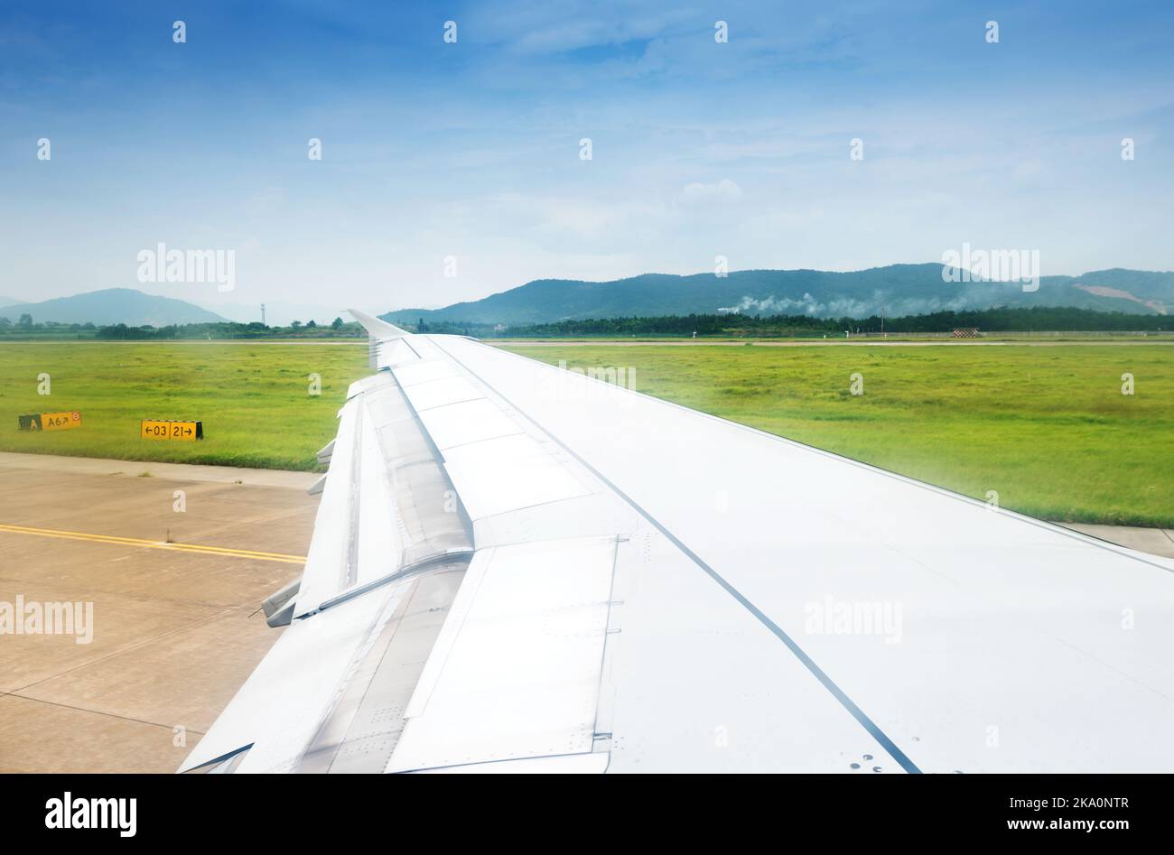 View of air plane wing during take off or landing Stock Photo - Alamy