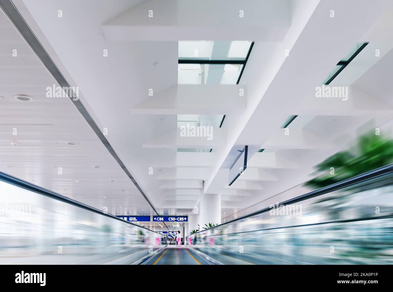 passenger rushing through an escalator in airport terminal Stock Photo ...