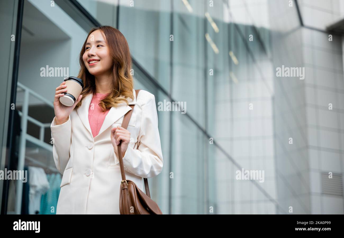 Happy business woman smiling hold paper cup of hot drink outdoor ...