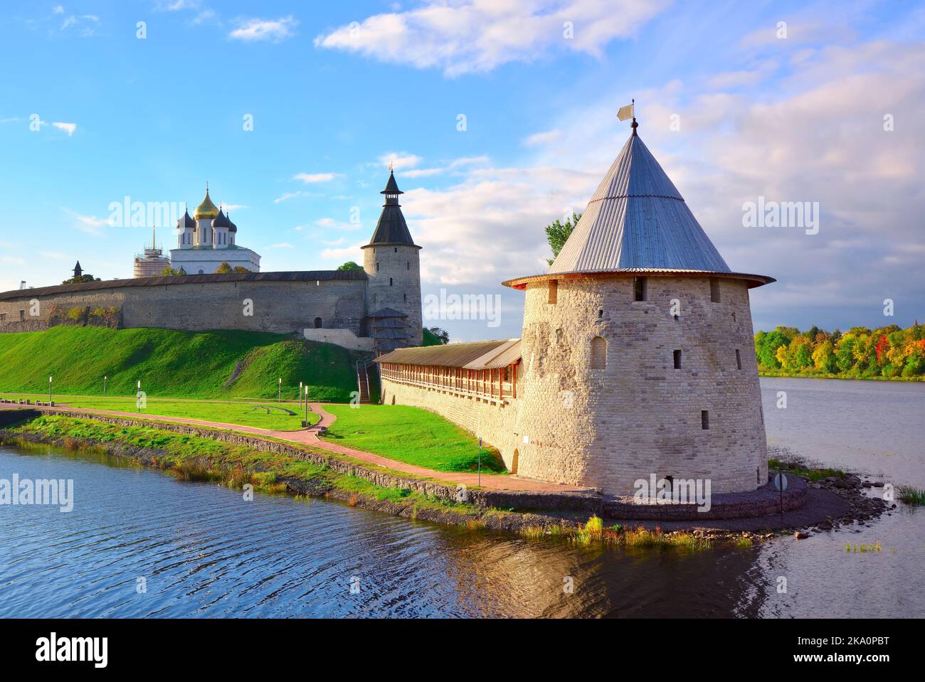 The Old Russian Pskov Kremlin. Fortress walls with a flat tower of the 14th century on a ...