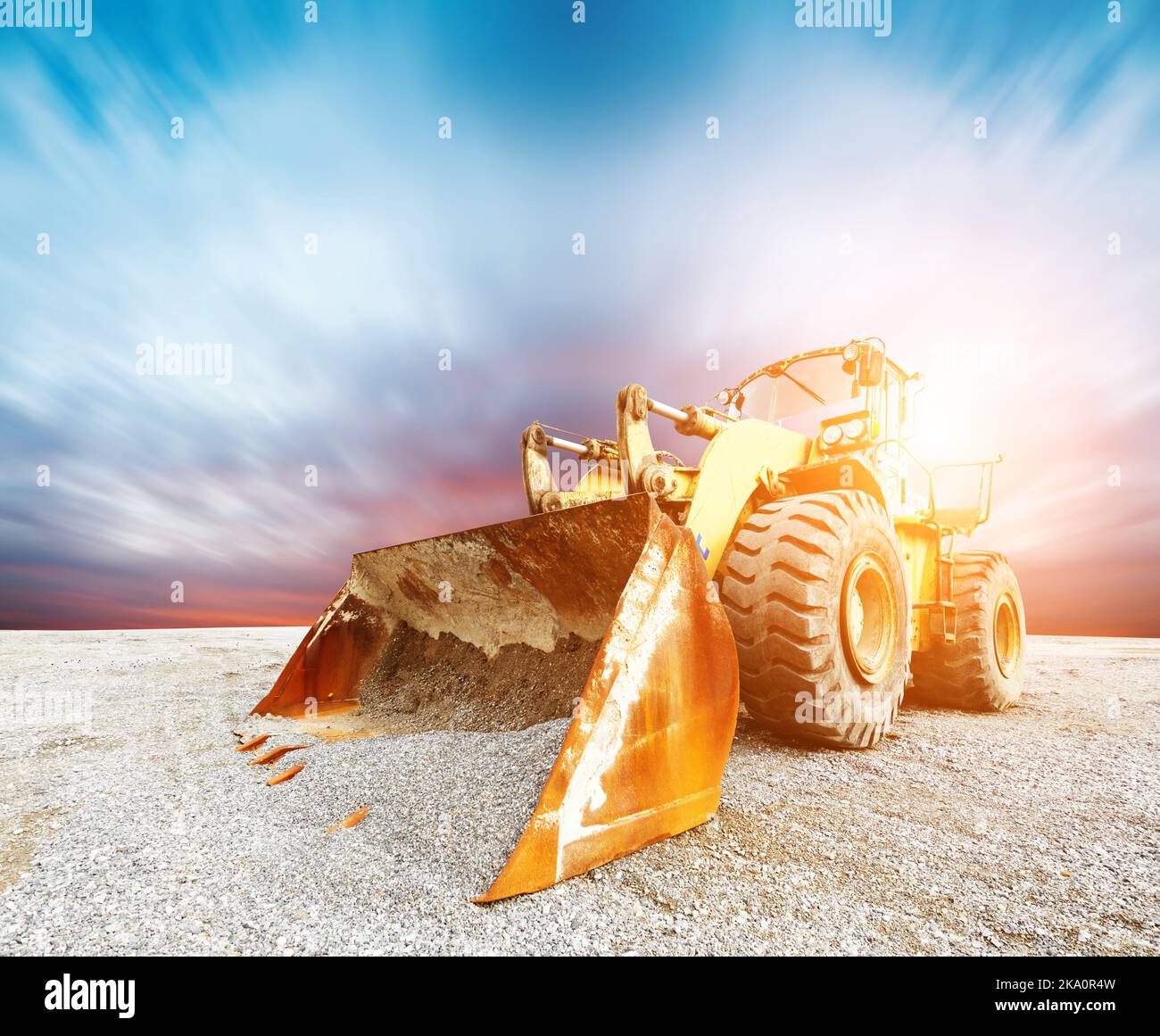 Big excavator on new construction site, in the background the blue sky ...