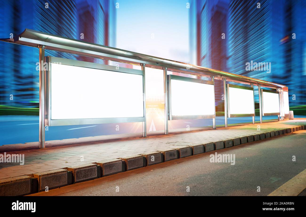 Blank billboard on bus stop at night Stock Photo - Alamy