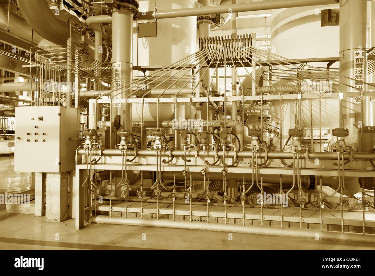 Equipment, cables and piping as found inside of industrial power plant ...