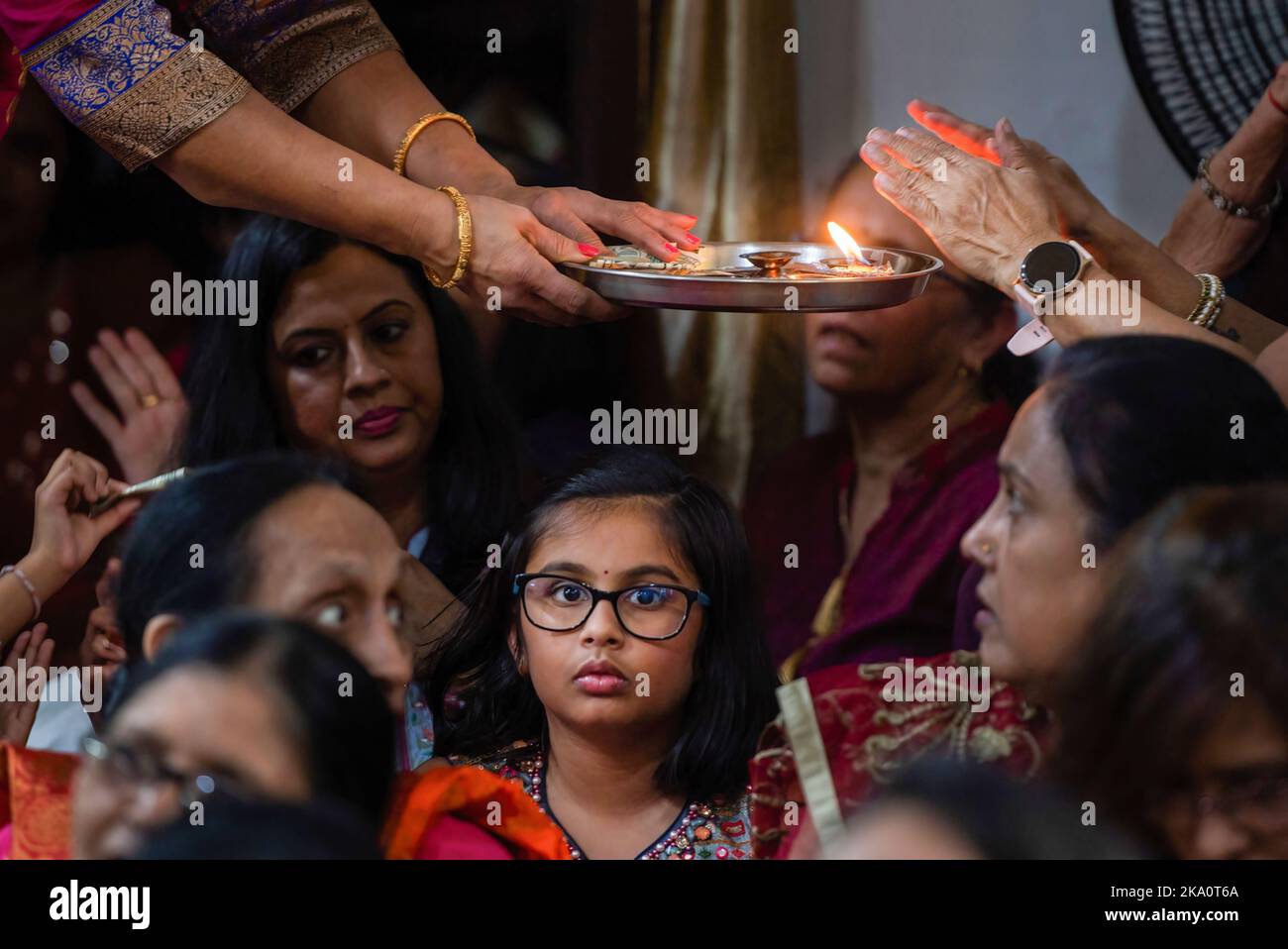 Scranton, United States. 30th Oct, 2022. A girl sits under candles ...