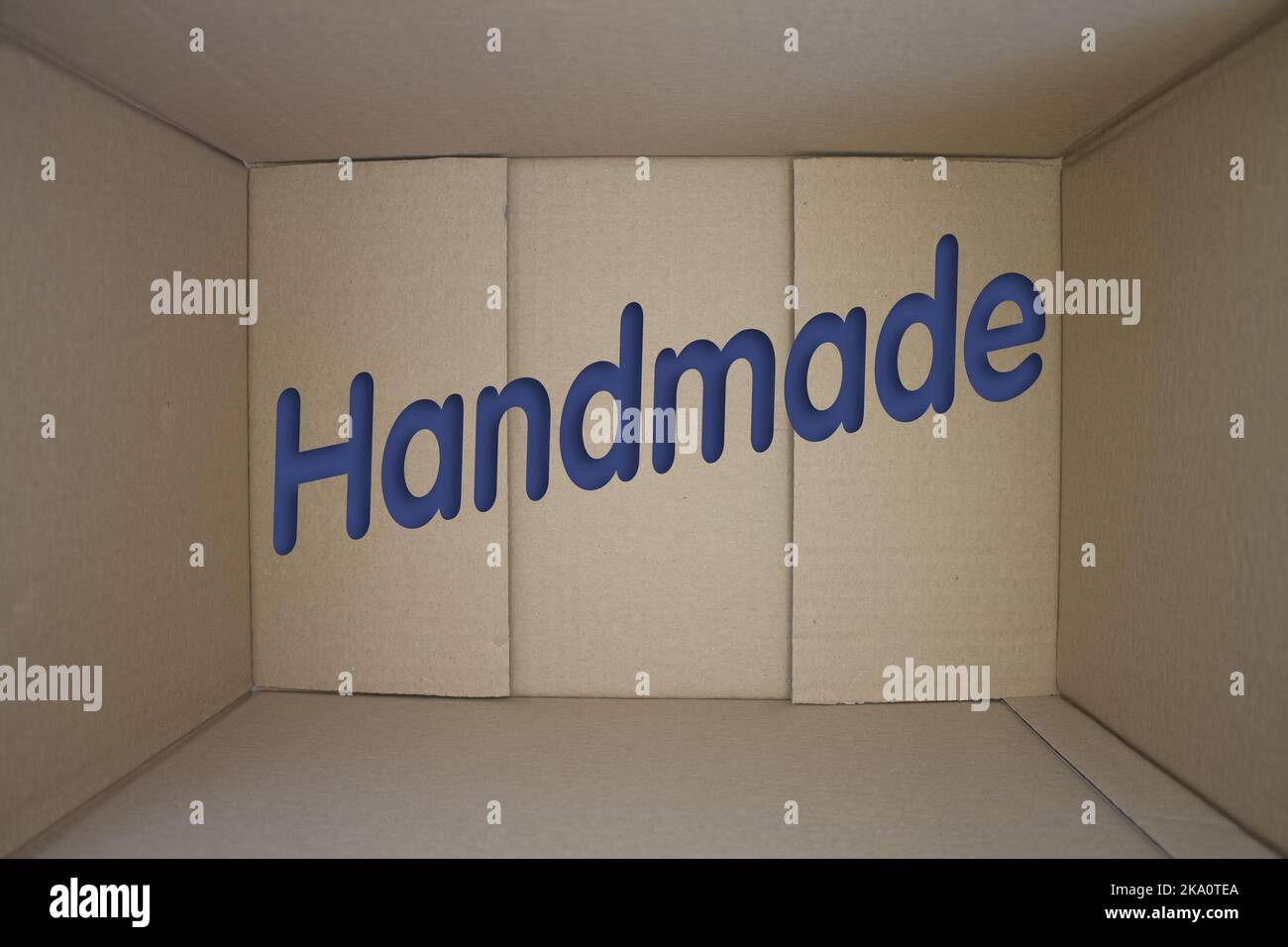 Handmade word with cardboard box. Brown folded card box Stock Photo - Alamy