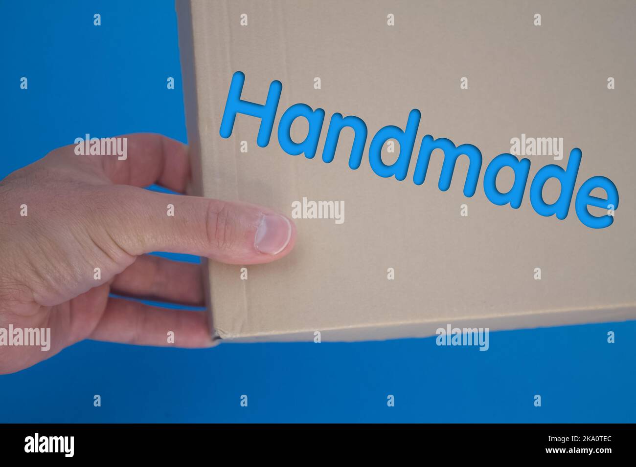 Handmade word with cardboard box. Brown folded card box Stock Photo - Alamy