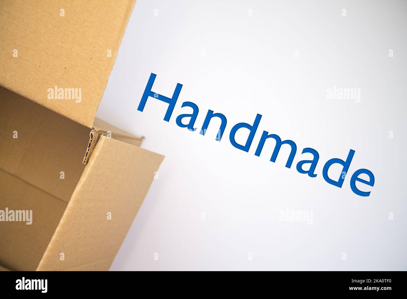 Handmade word with cardboard box. Brown folded card box Stock Photo - Alamy