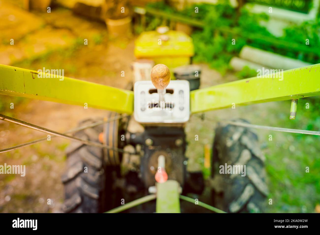 Gear lever on a walk-behind tractor close-up on a blurred background ...
