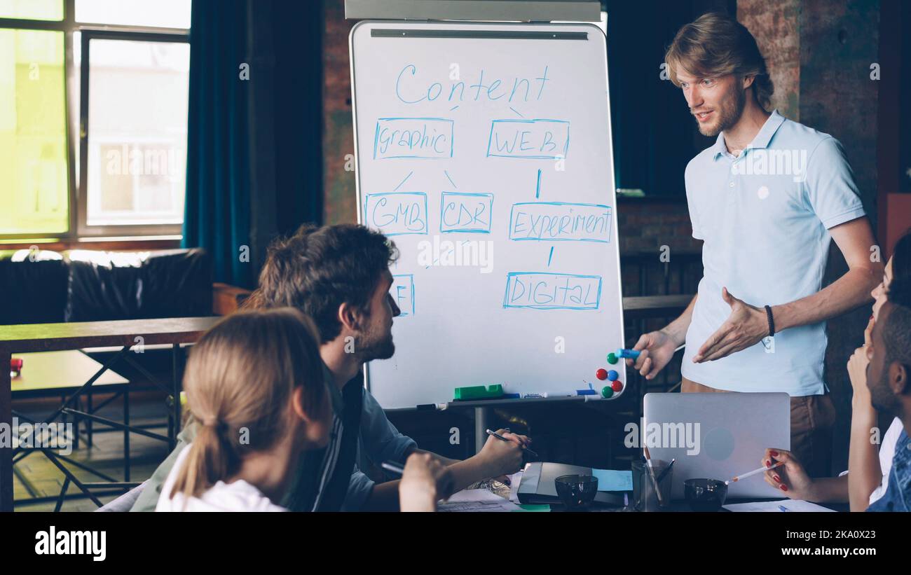 Focused business people working whiteboard hi-res stock photography and ...