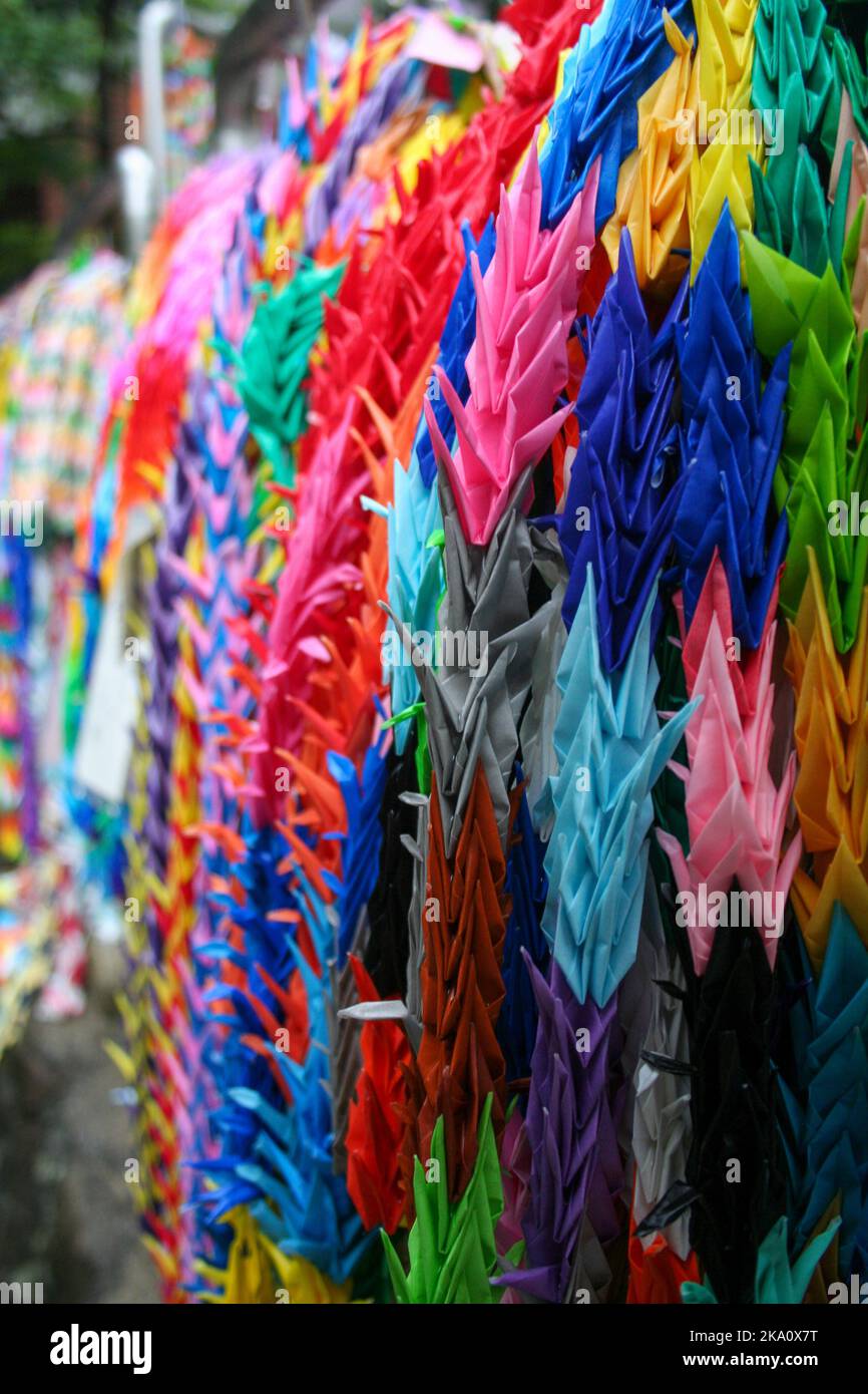Colorful rainbow of paper cranes at Nagasaki Nuclear Bomb Ground Zero ...