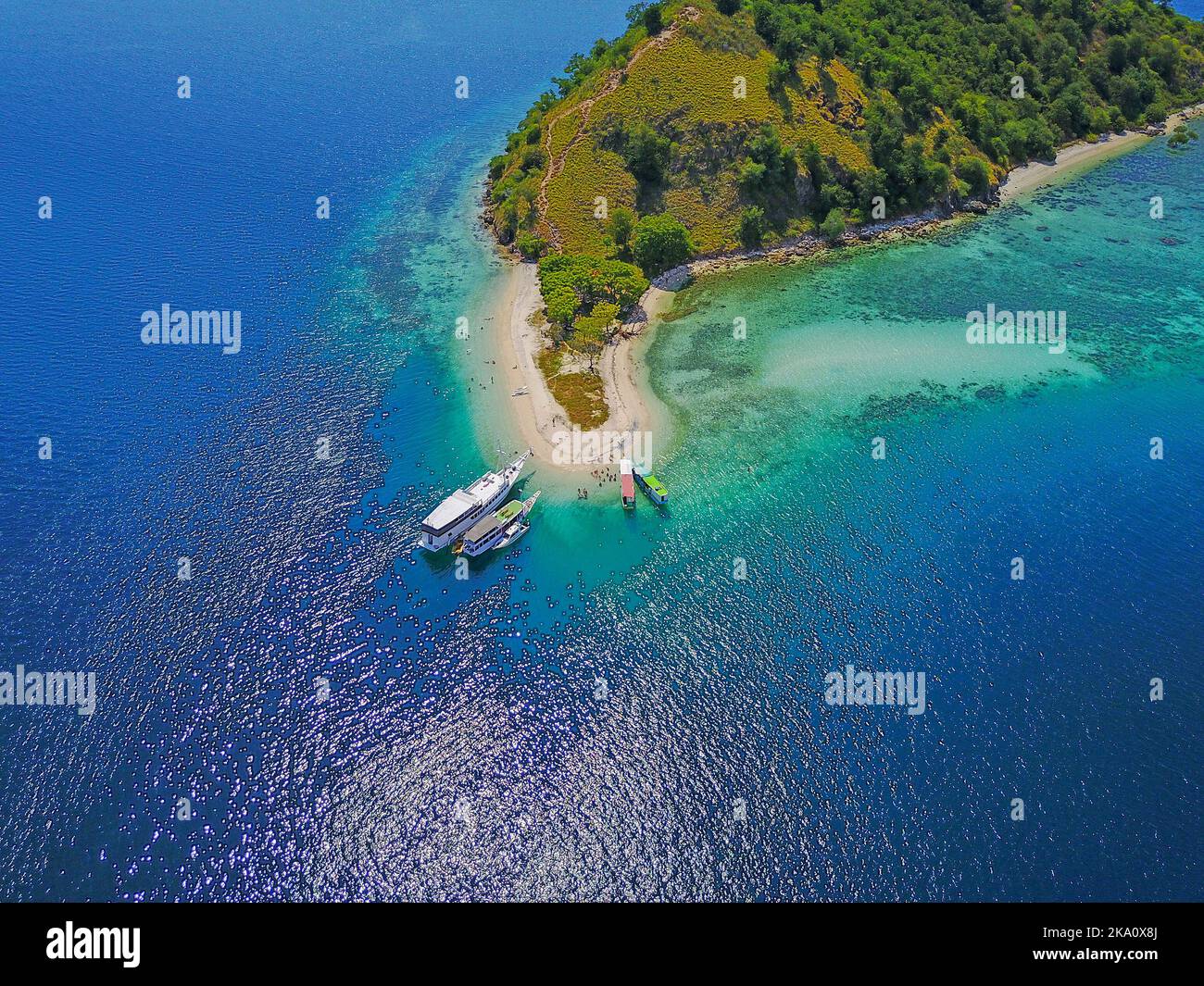 Beautiful aerial view of beaches and tourist boat sailing in Flores ...