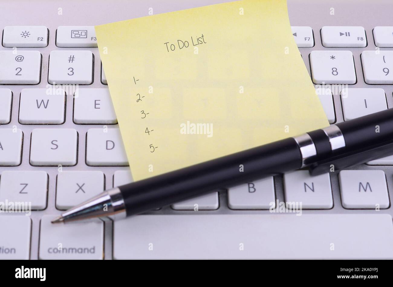 To Do List word on sticky noted with modern keyboard at background ...