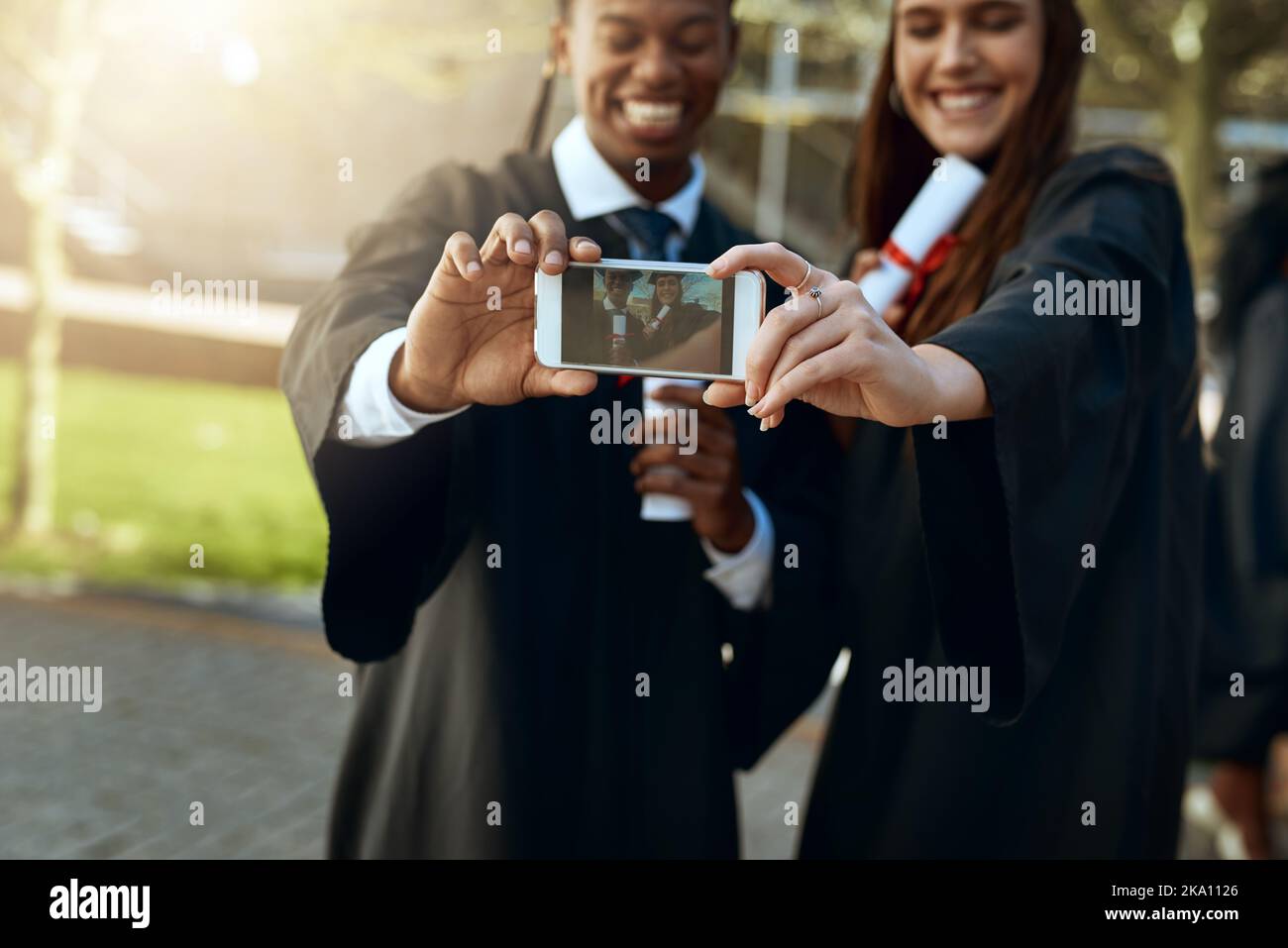 Happy graduation day. a young man and woman taking selfies with a ...