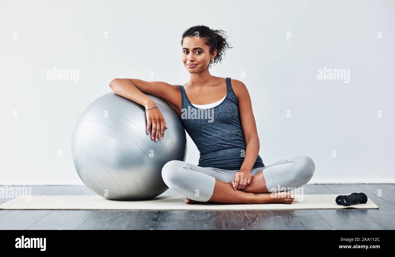 I put my healthy first. a sporty young woman leaning against a exercise ...