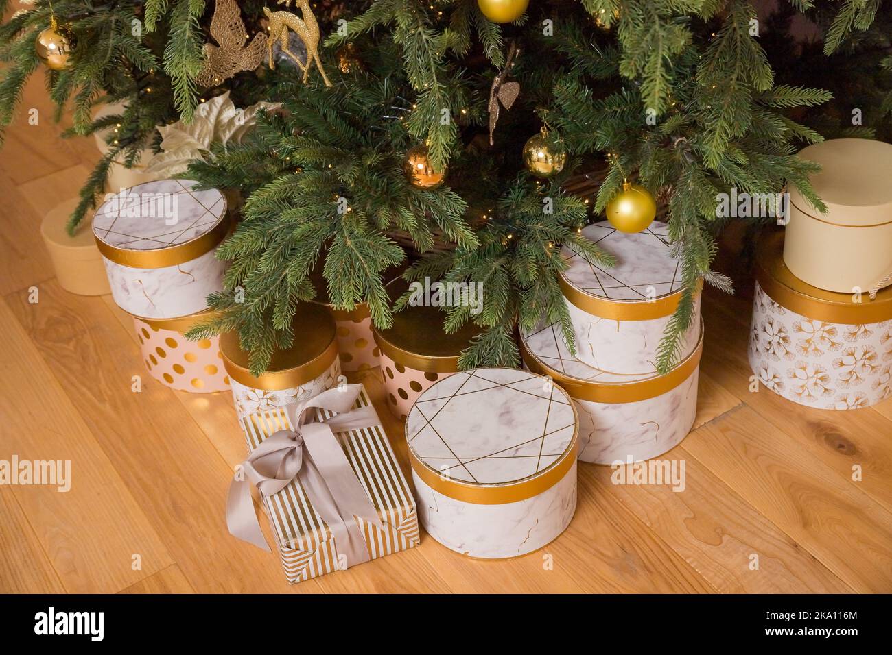 luxury gift boxes under Christmas tree, New Year home decorations ...