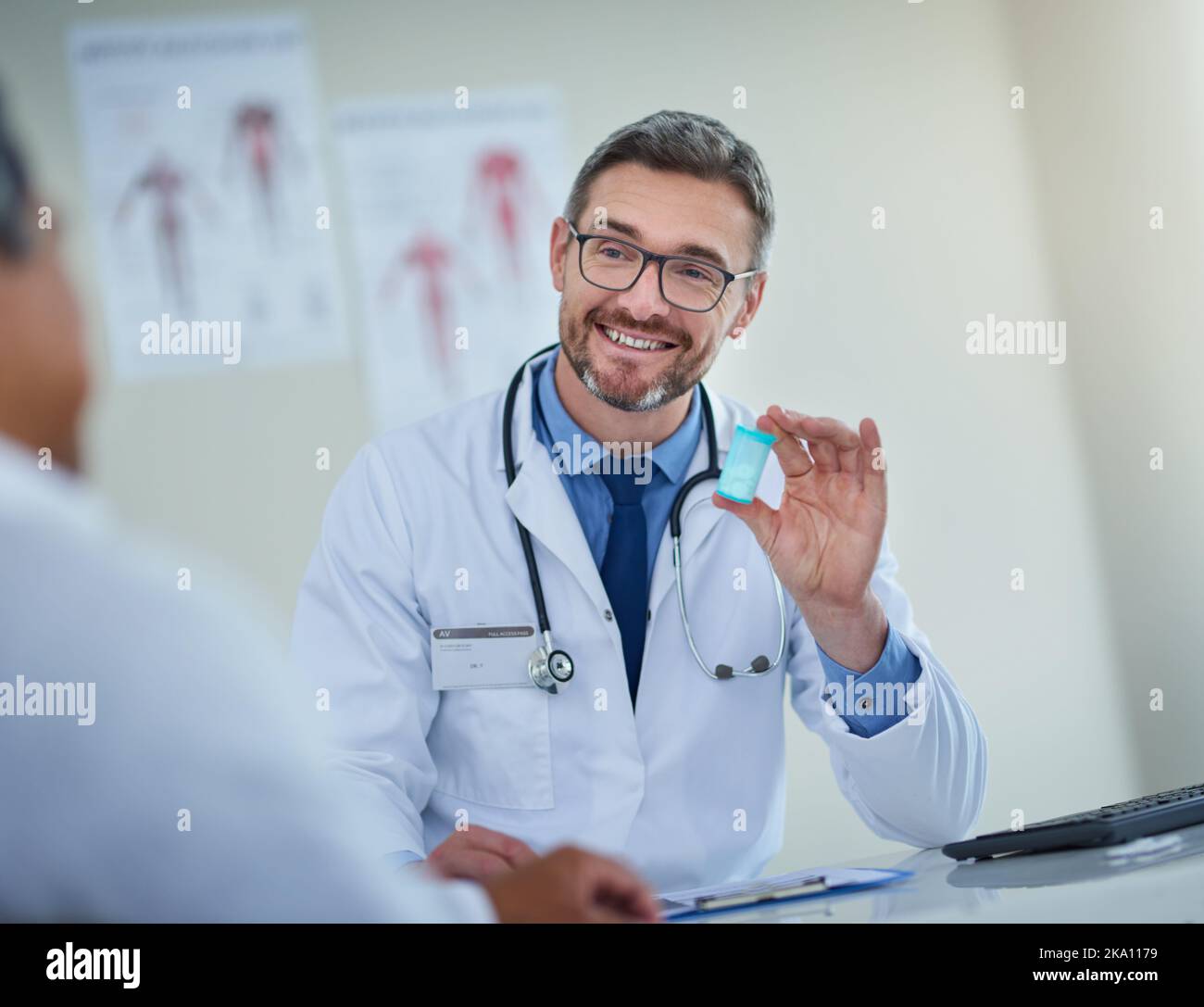 This should clear your symptoms in no time. a mature doctor prescribing ...