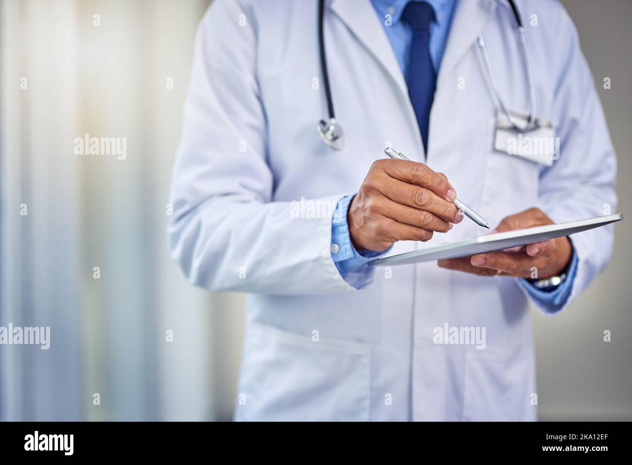 Make a note of everything important. an unrecognizable male doctor ...