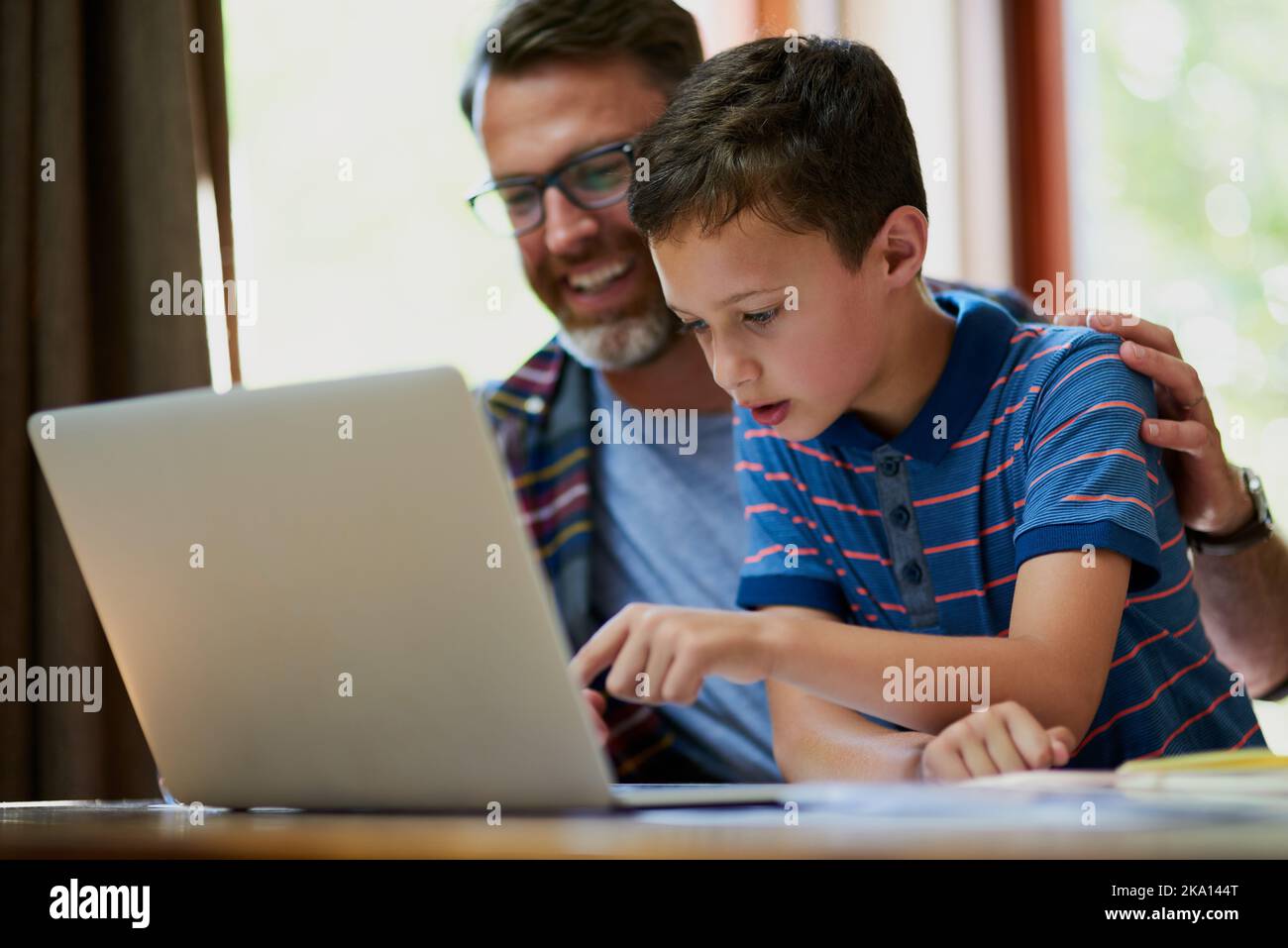 Teaching my son how to use this device. a mature father and his ... Teaching my son how to use this device. a mature father and his ...