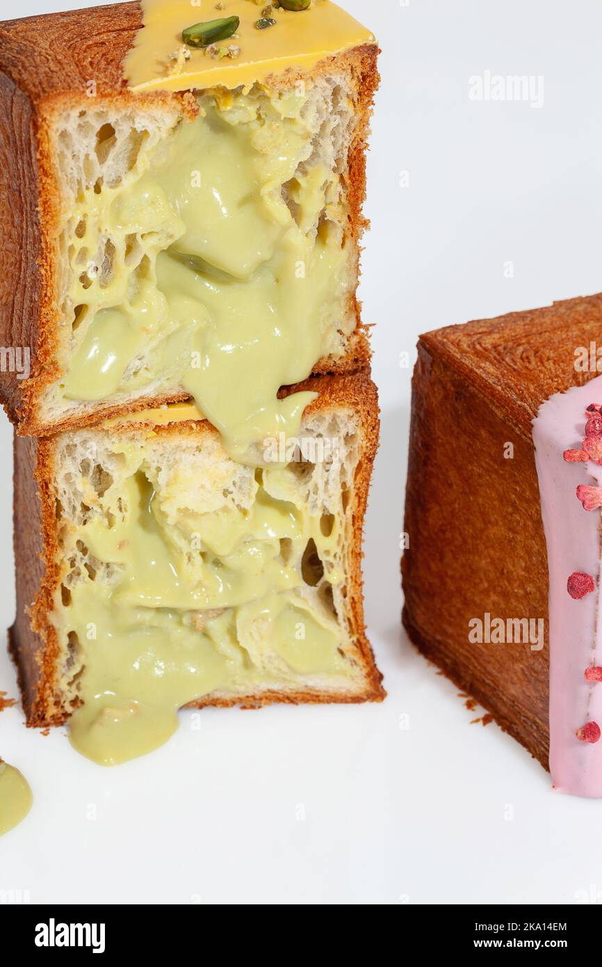 Sliced puff pastry cube shaped croissant with pistachio custard cream ...