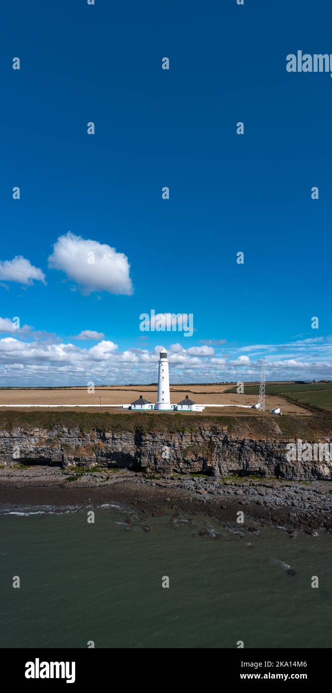 A vertical panorama of the Nash Point Lighthouse and Monknash Coast in ...