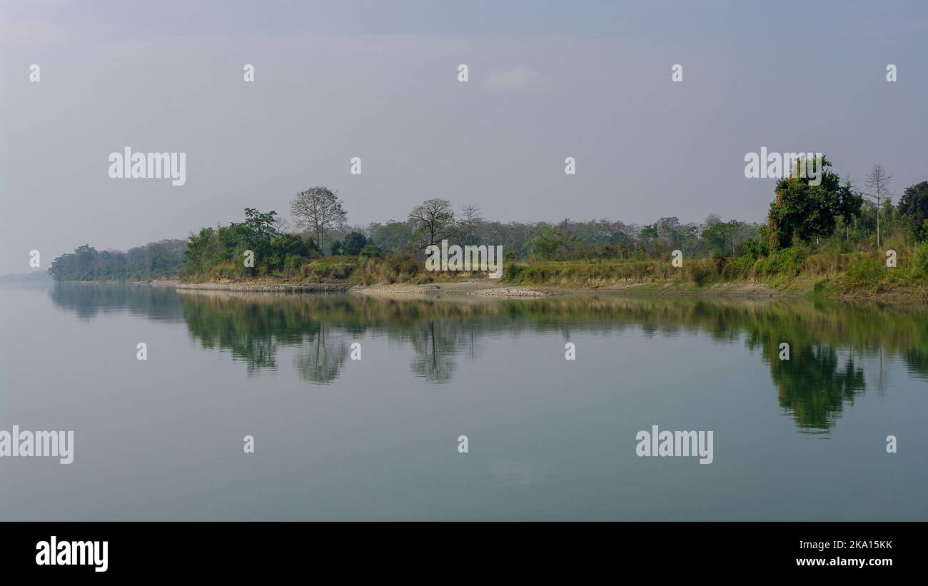 Peaceful landscape panorama of Brahmaputra river bank with trees ...