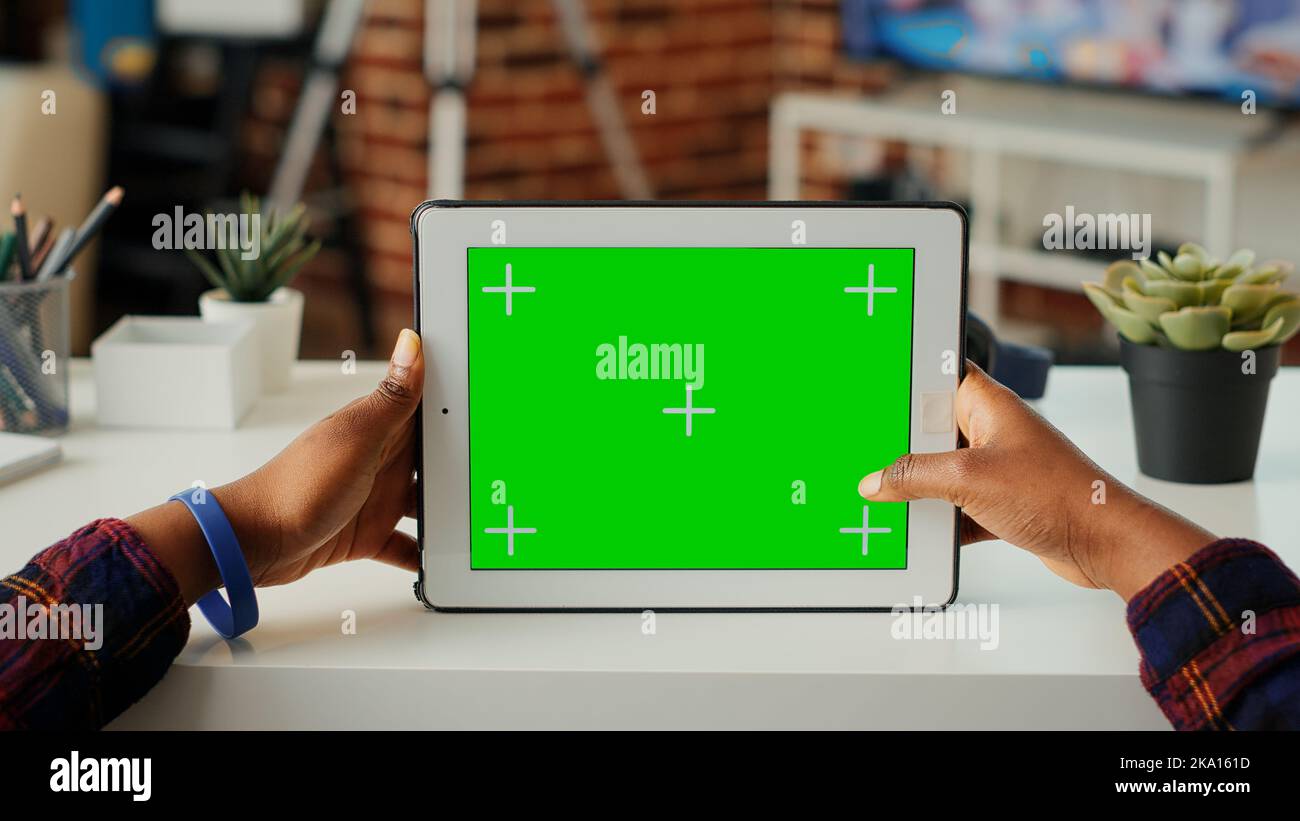 Female freelancer using horizontal greenscreen hi-res stock photography ...