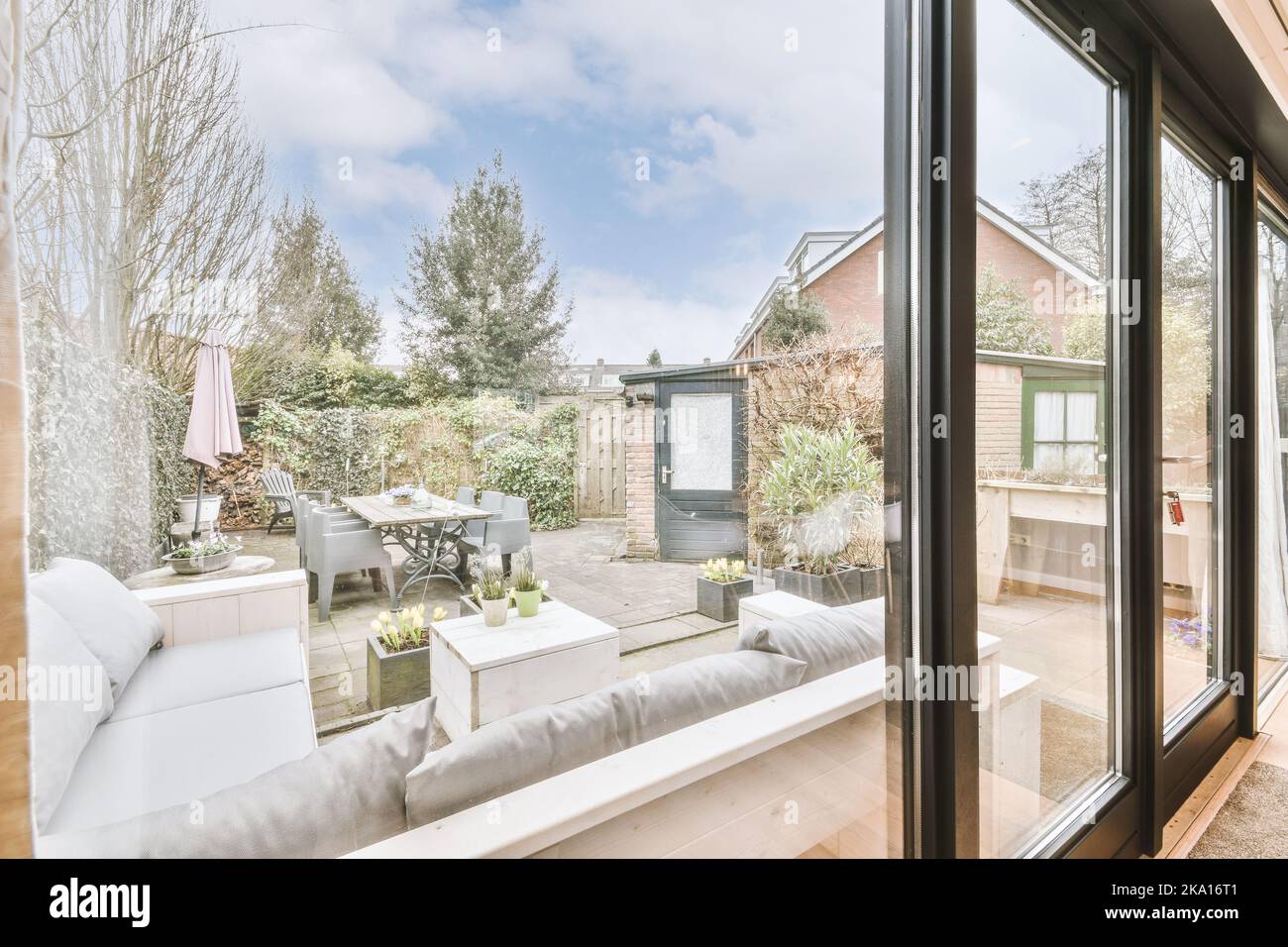 Room with door to balcony and narrow long corridor in perspective in ...