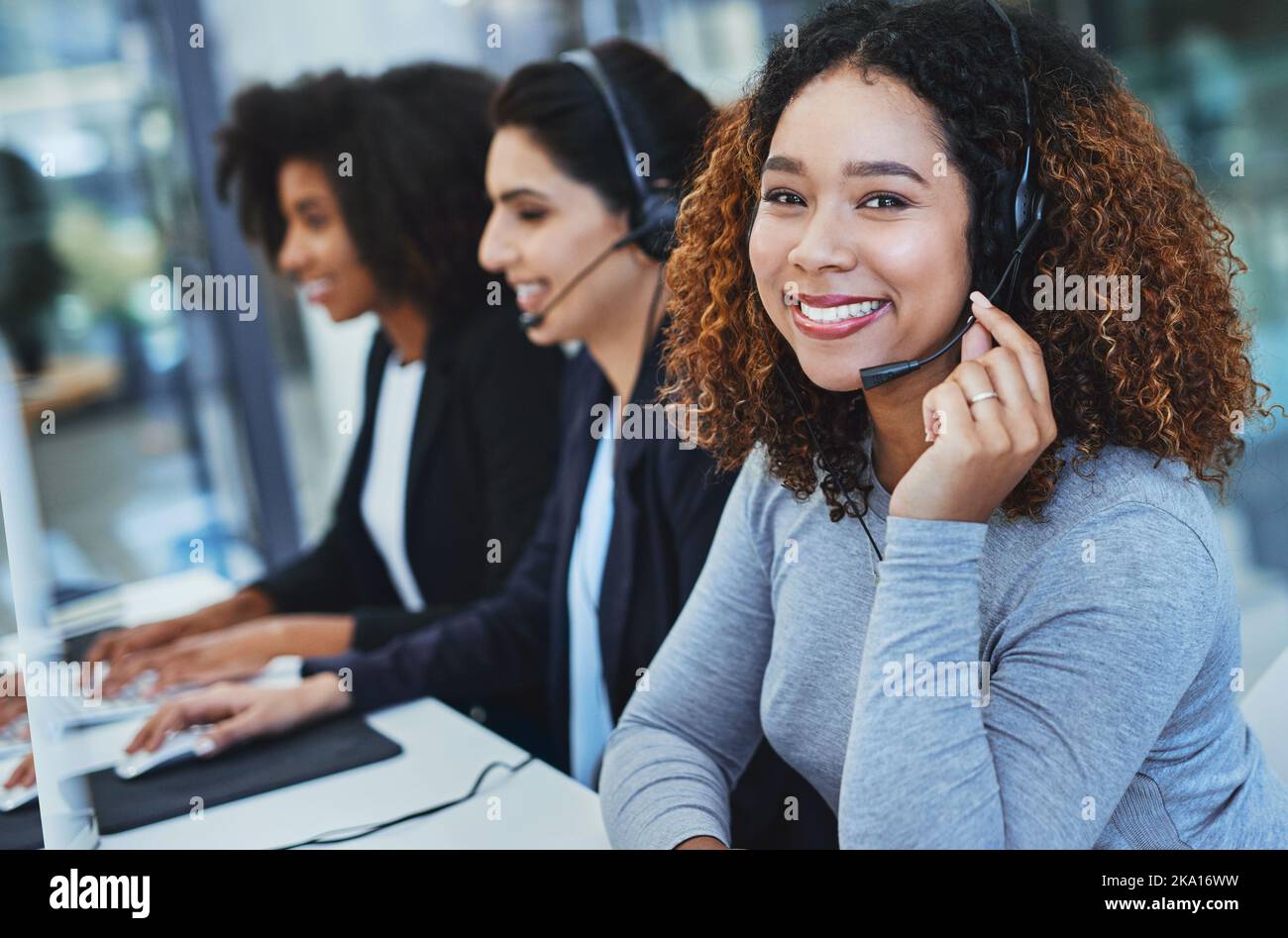 Client satisfaction is our daily commitment. Portrait of a young woman ...