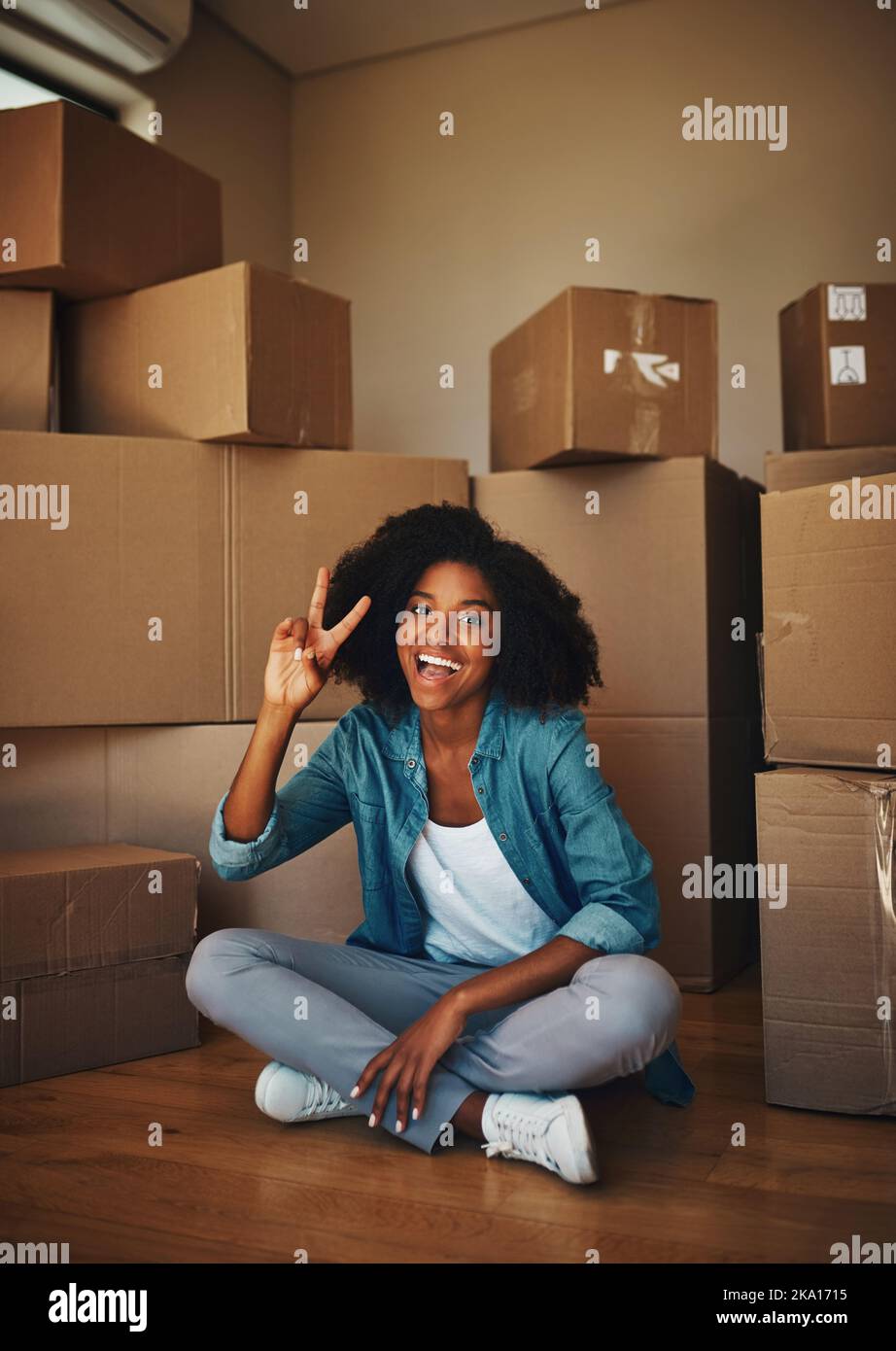 Keeping the peace in the family. Portrait of a cheerful young woman ...