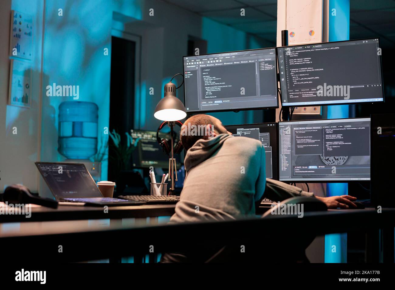 Database Admin Typing Programming Code On Computer With Multiple Monitors Working With Html