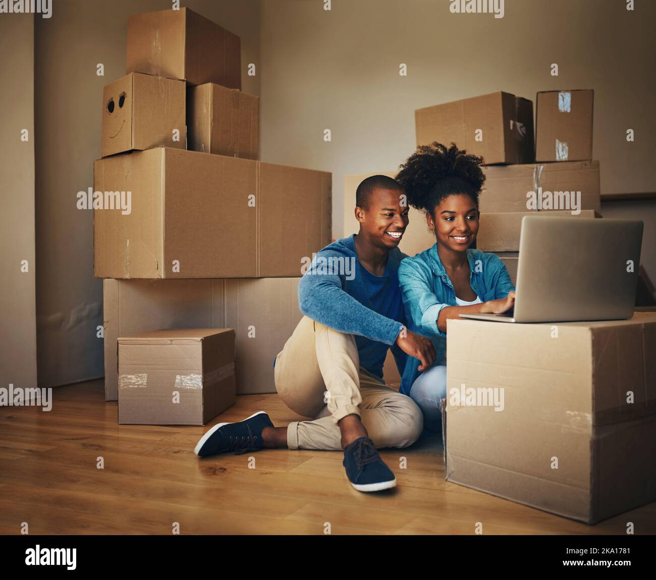 What else could we possibly need. a cheerful young couple browsing on a ...