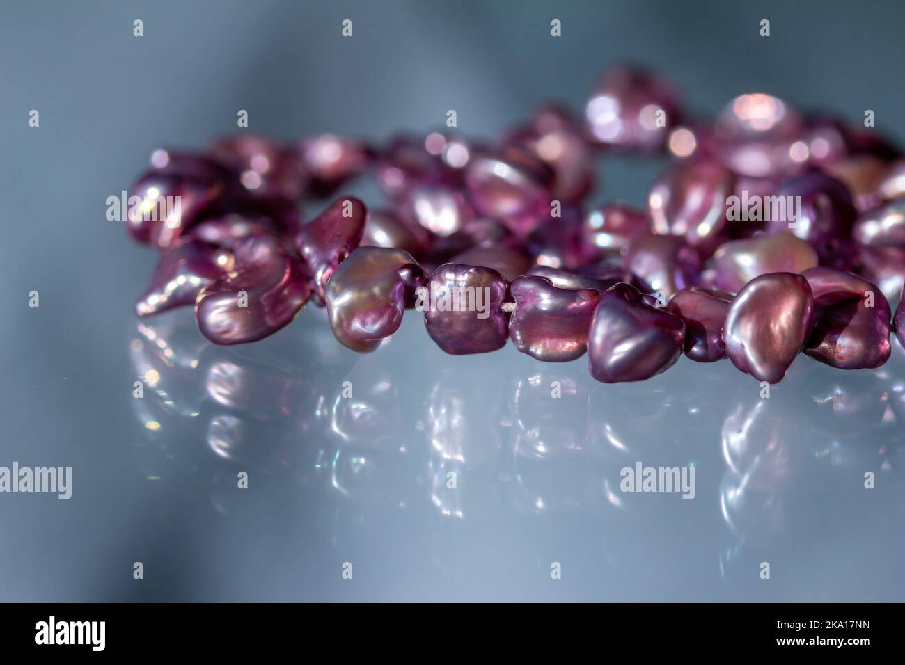 Macro abstract texture background of a necklace containing deep pink ...