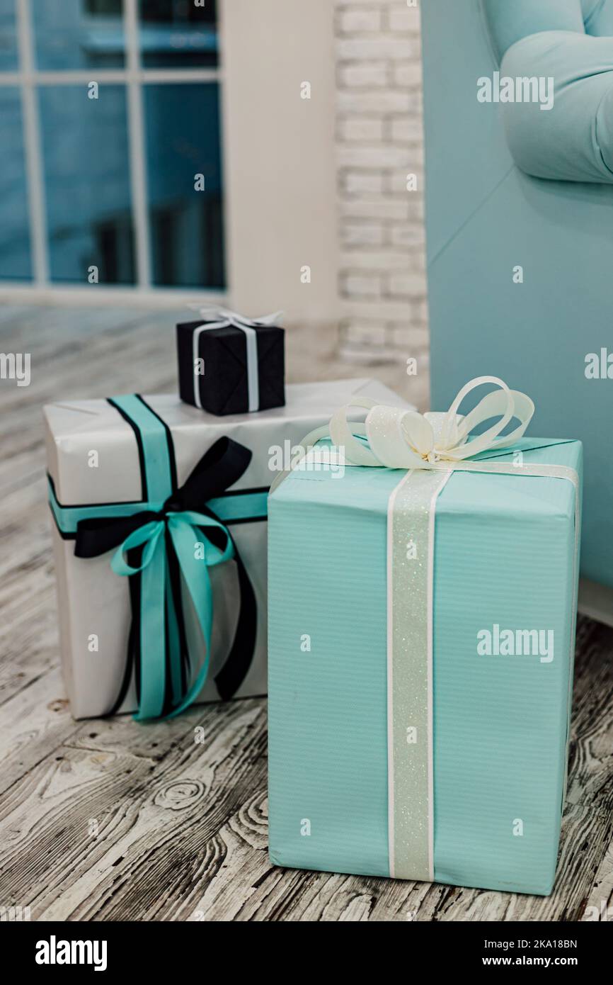 Blue gift boxes, sofa, window and brick wall Stock Photo - Alamy