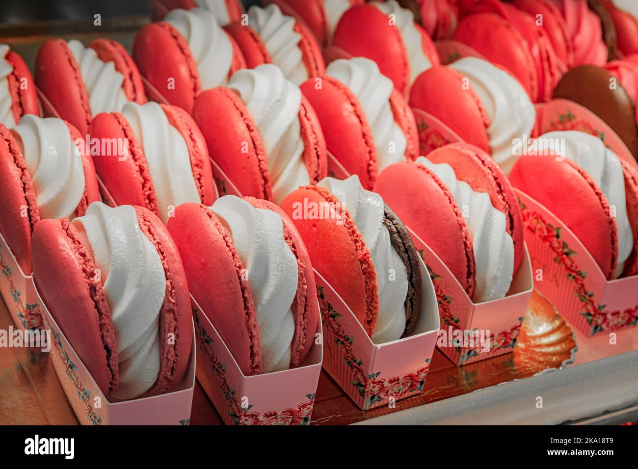 Colorful macarons cookies in box packages for sale at a bakery in the ...