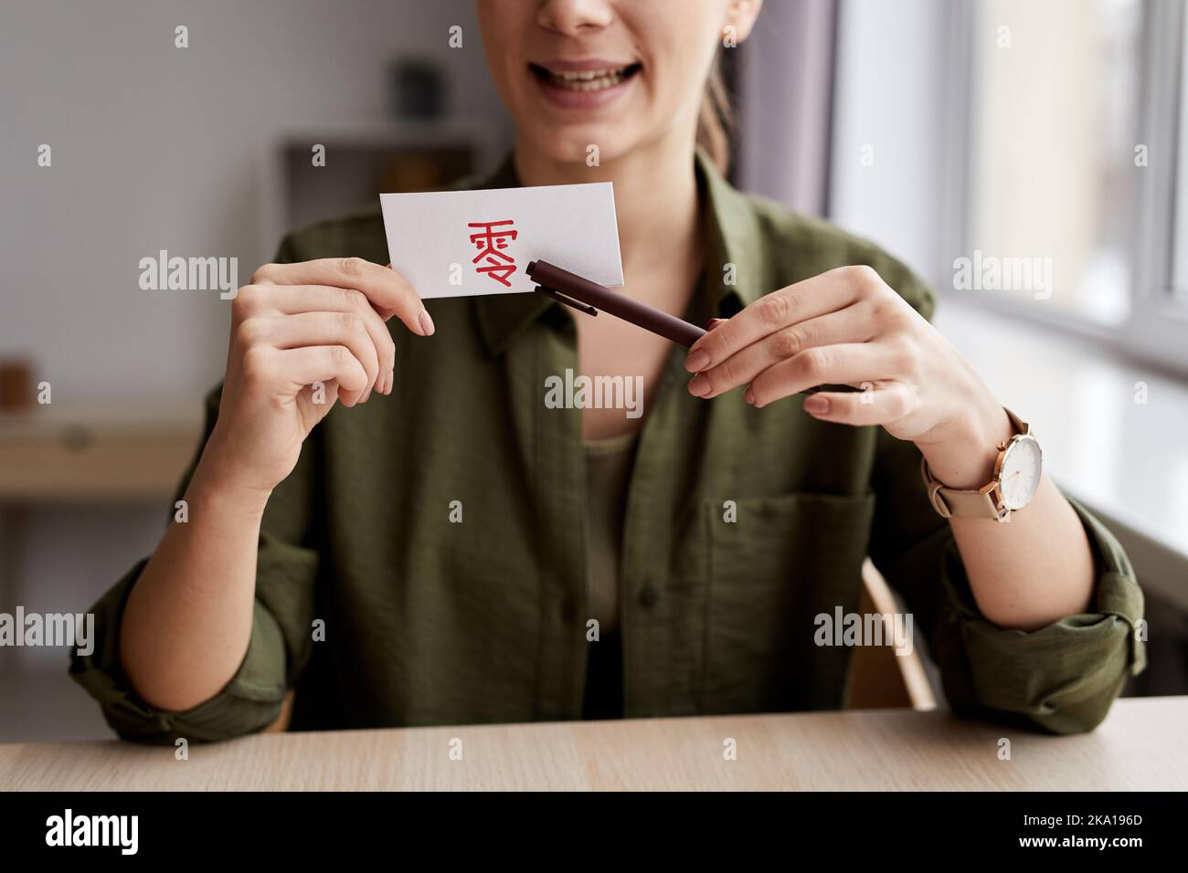 Hands of young confident tutor of Chinese language pointing at ...