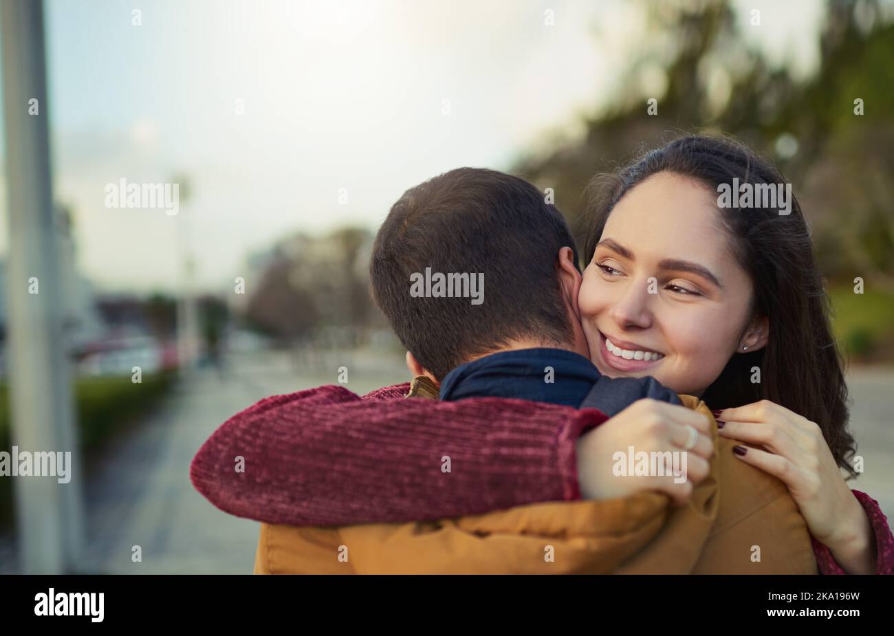 Heartfelt hugs, priceless. a happy young couple embracing each other ...
